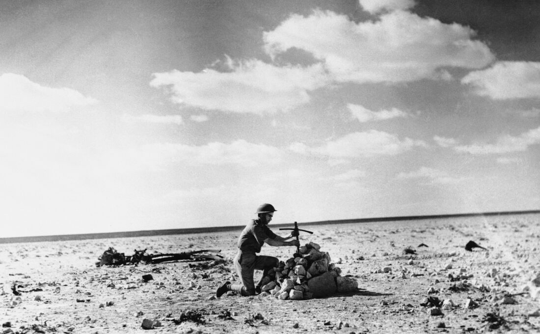 RAF airman placing a cross | News, Sports, Jobs - The Express